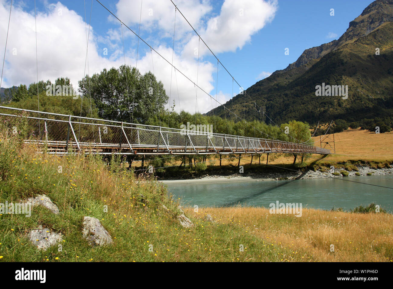 New Zealand - Mt Aspiring National Park. Touristic trail footbridge ...