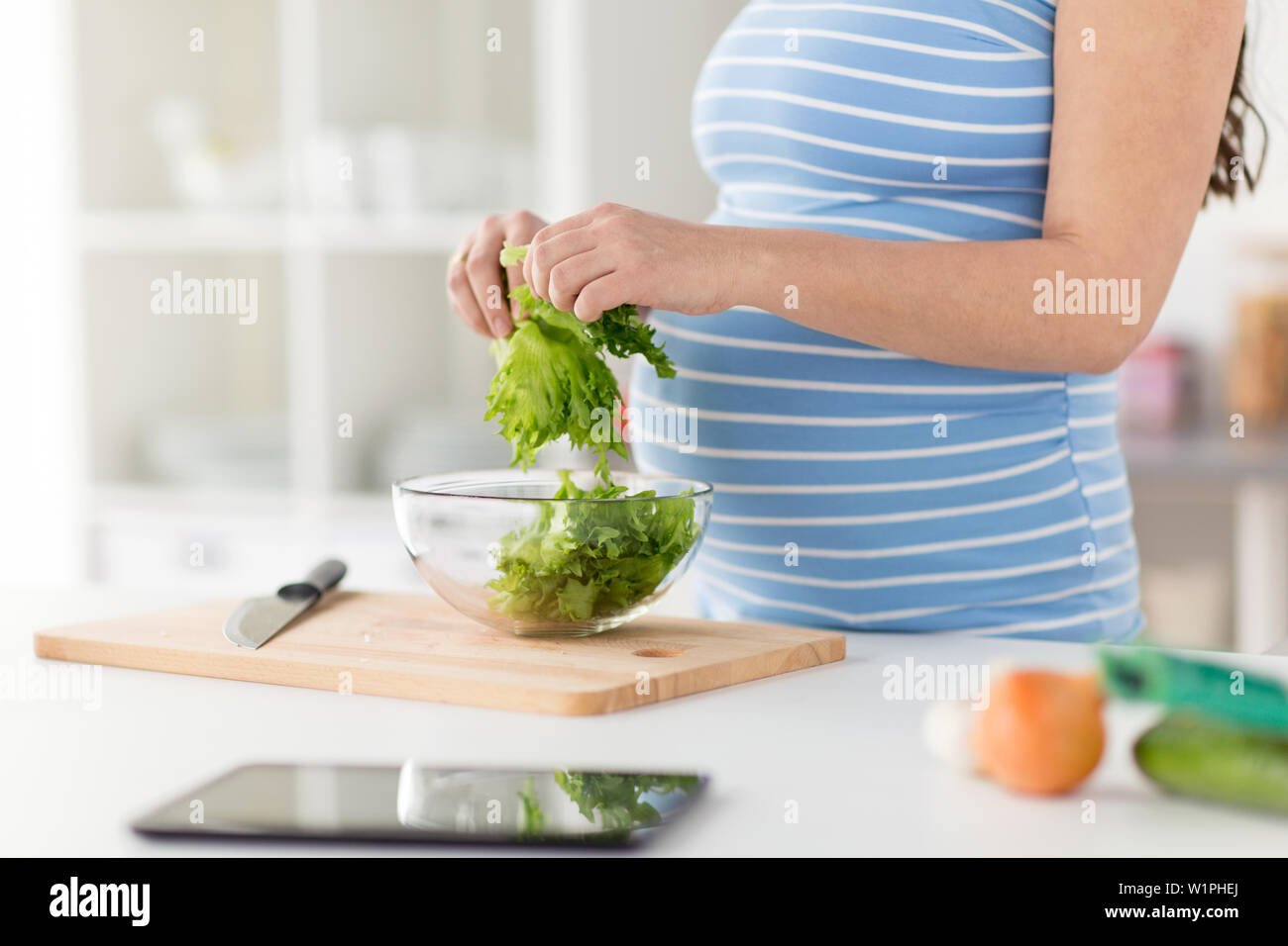 Pregnant woman cooking food hi-res stock photography and images - Alamy