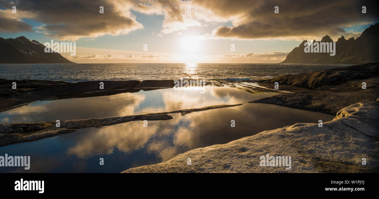tidal pools during midnightsun at the coast of Tungeneset with devils ...