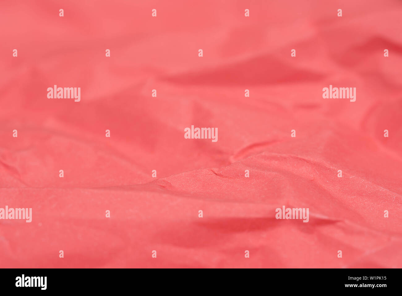 red creased color paper texture background selective focus closeup ...