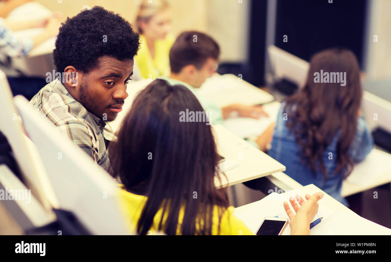 group of students talking in lecture hall Stock Photo - Alamy