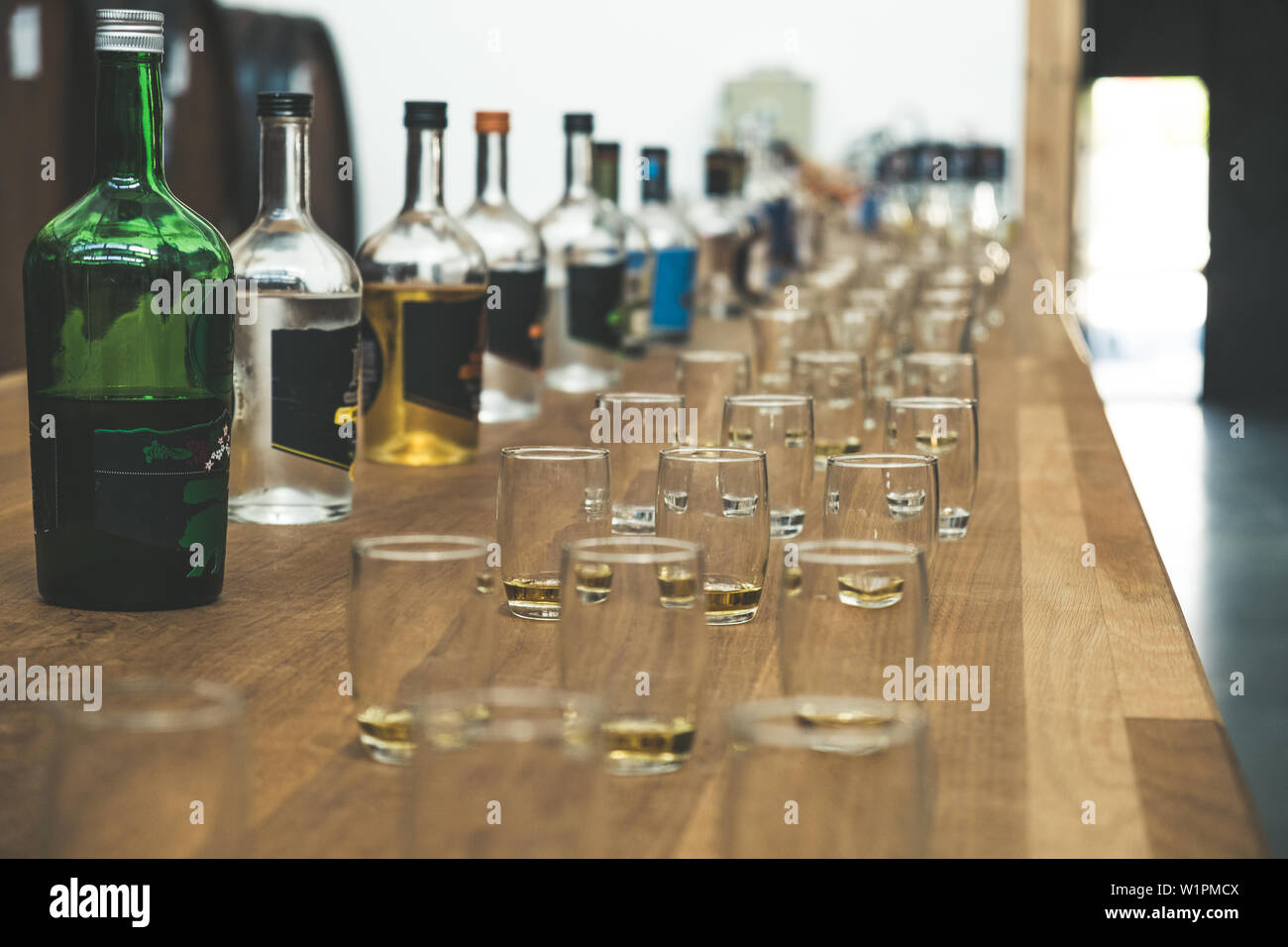 Empty alcohol bottles table hi-res stock photography and images - Alamy