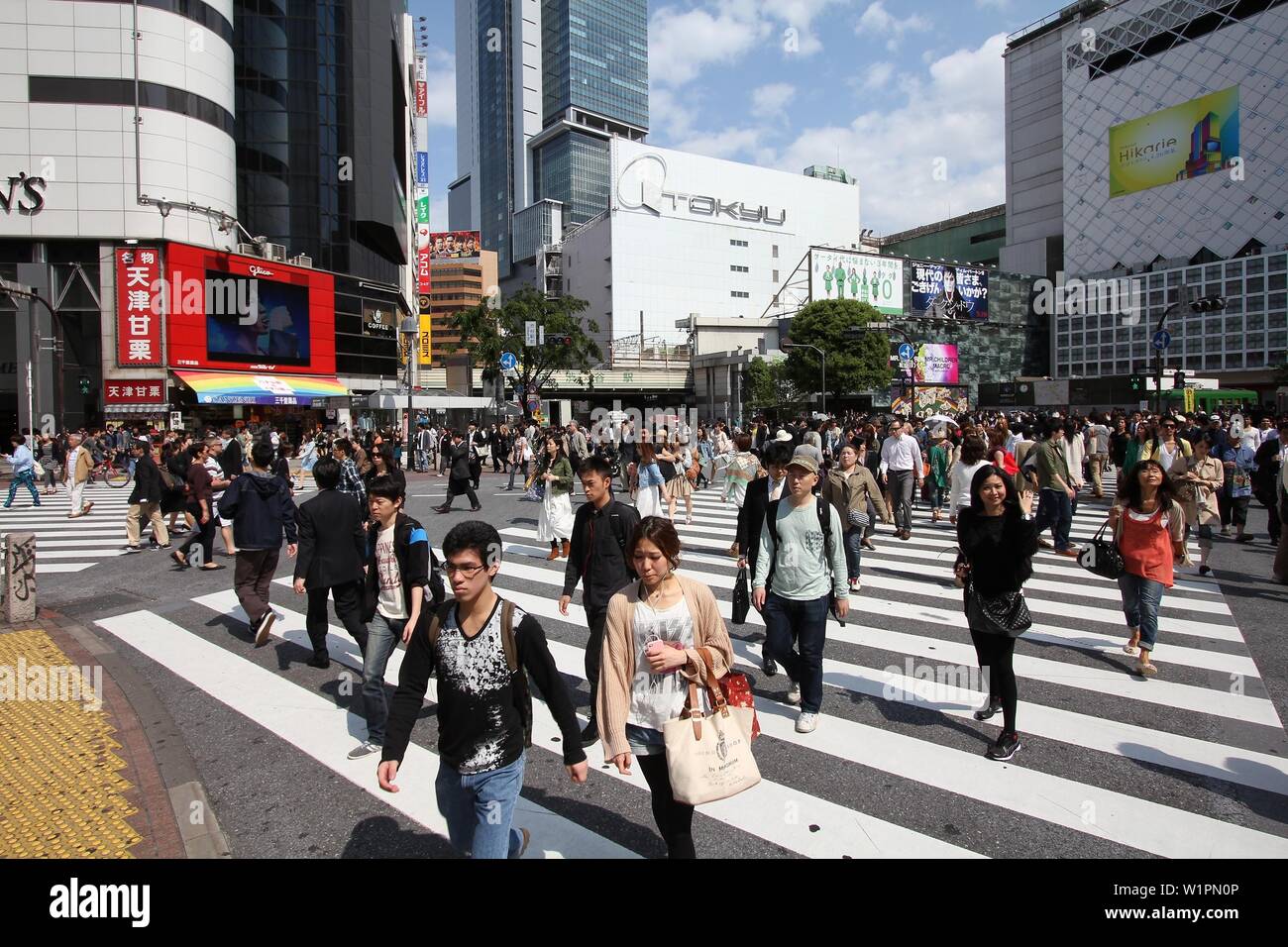 TOKYO, JAPAN - MAY 11, 2012: People walk the Hachiko crossing in ...