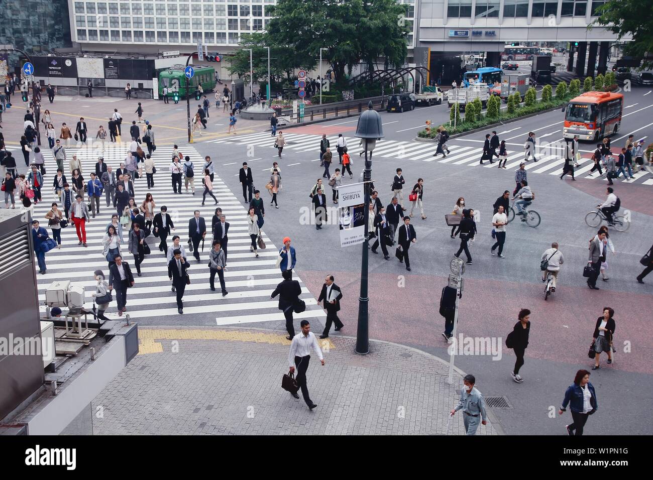 TOKYO, JAPAN - MAY 9, 2012: People walk the Hachiko crossing in Shibuya ...