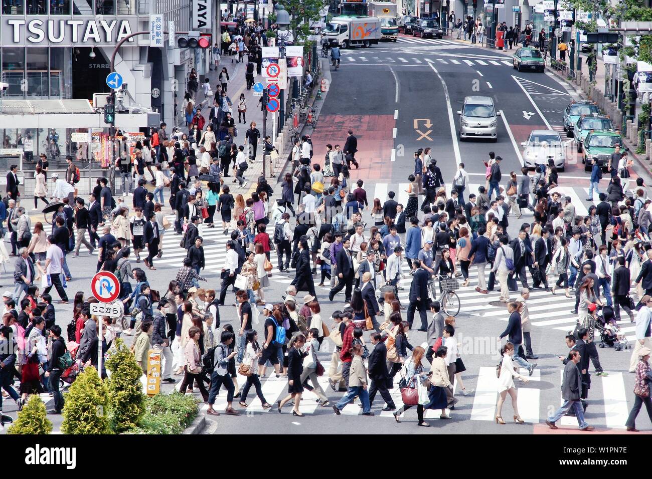 TOKYO, JAPAN - MAY 11, 2012: People walk the Hachiko crossing in ...