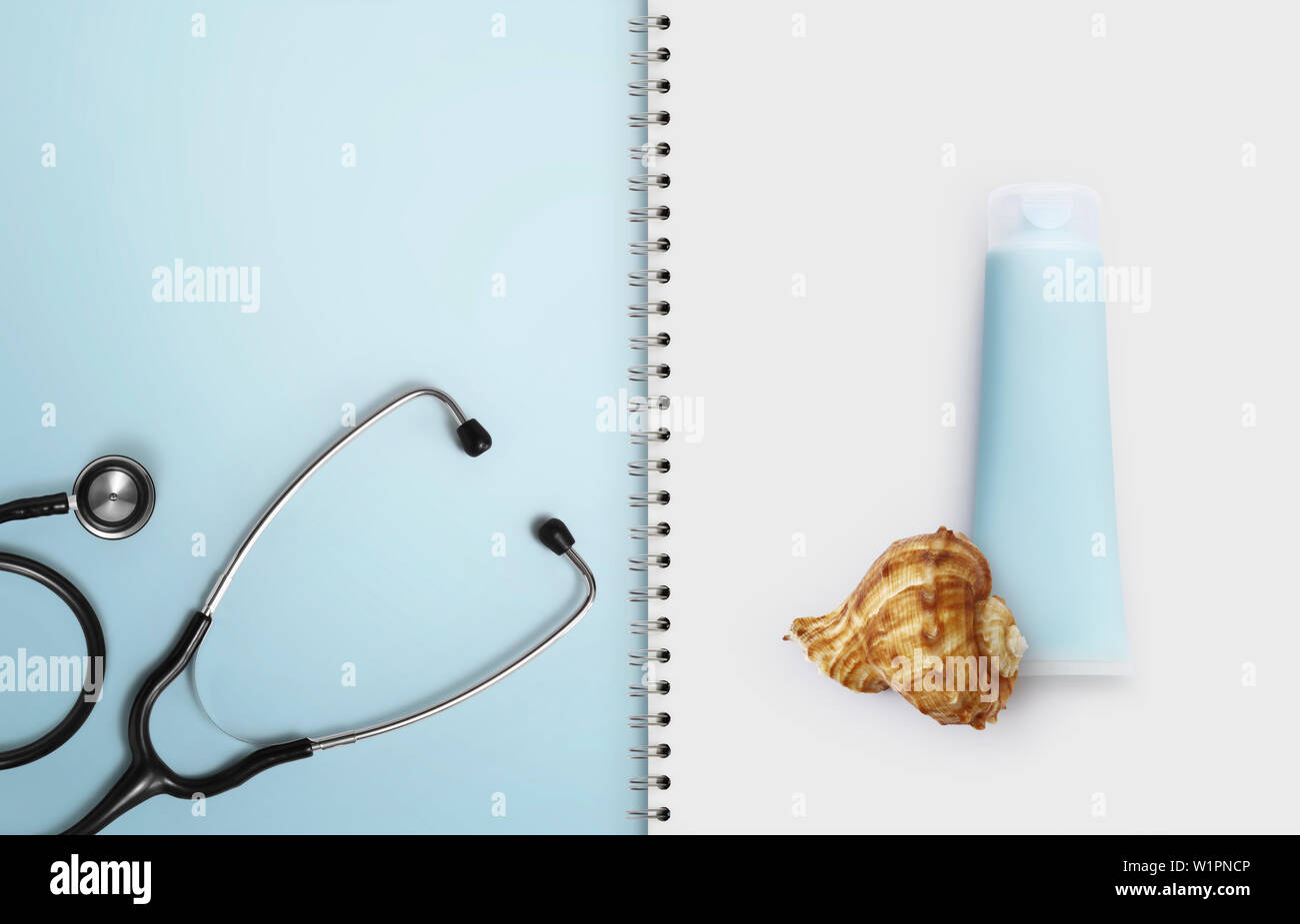 medical sunscreen, paper notebook pages with stethoscope, tube sun ...