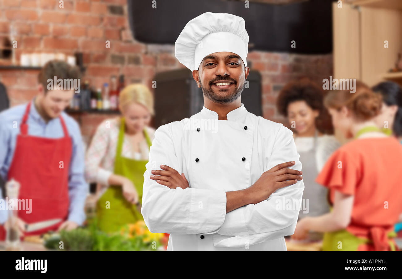 happy male indian chef in toque at cooking class Stock Photo - Alamy