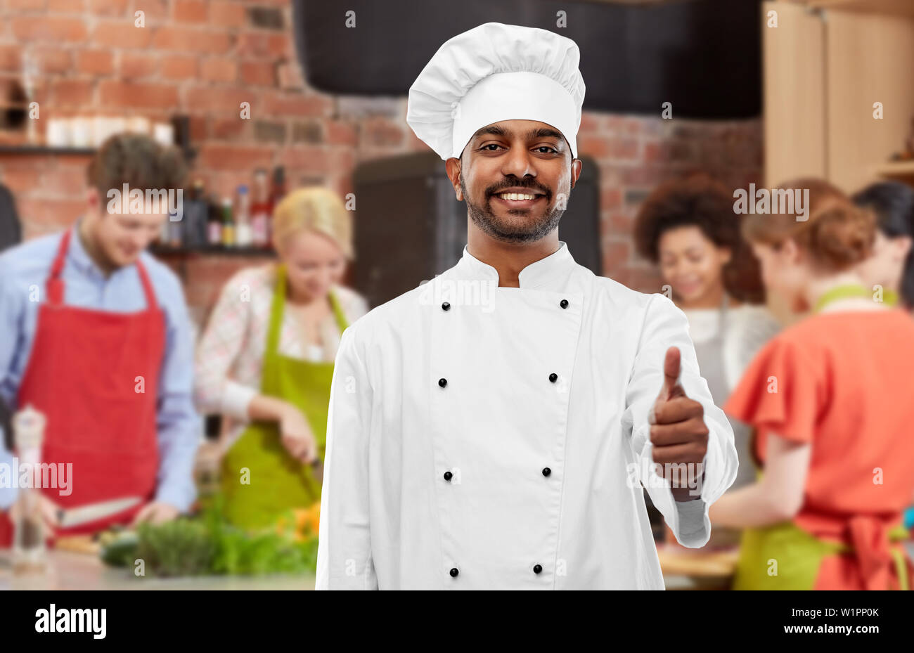 indian chef showing thumbs up at cooking class Stock Photo - Alamy