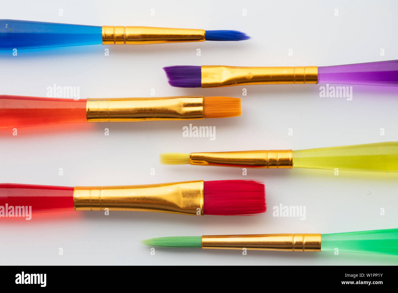 Colourful creative paintbrush art supply background Stock Photo - Alamy