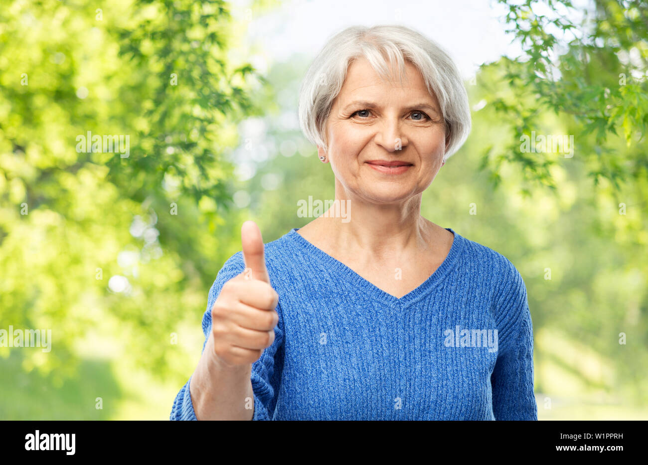 Old woman thumbs up gesture hi-res stock photography and images - Alamy