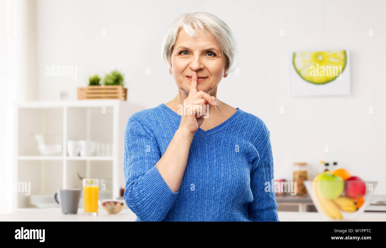 Woman making silence gesture in hi-res stock photography and images - Alamy
