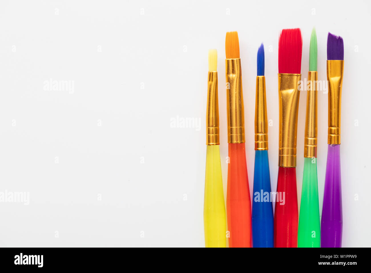Colourful creative paintbrush art supply background Stock Photo - Alamy