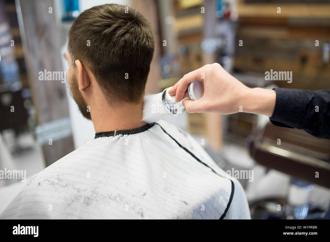 barber with brush cleaning male neck at barbershop Stock Photo - Alamy