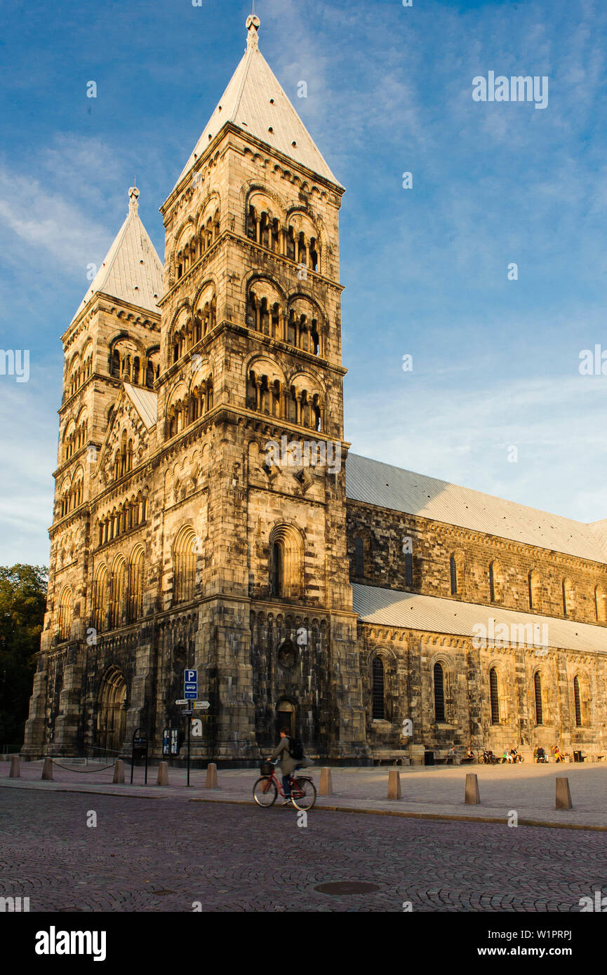 Cyclist in front of cathedral, interior Astronomical Clock, Lund, Skane ...