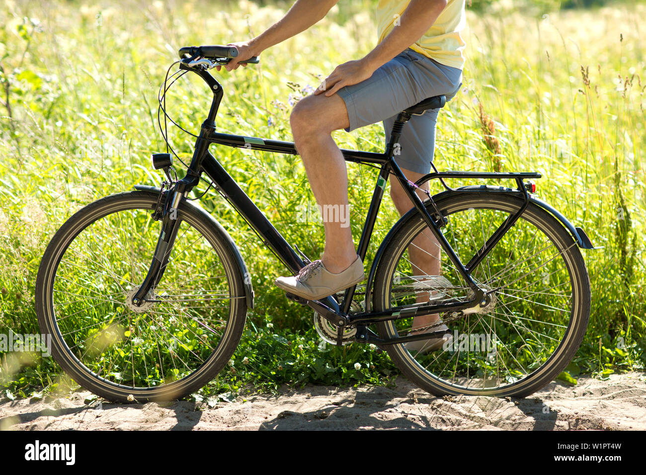 close up of man riding bicycle outdoors Stock Photo - Alamy