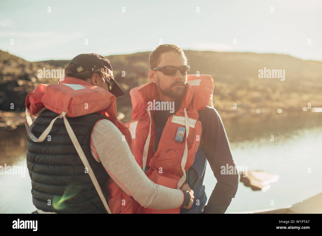 Hikers put on life jackets , greenland, arctic Stock Photo - Alamy