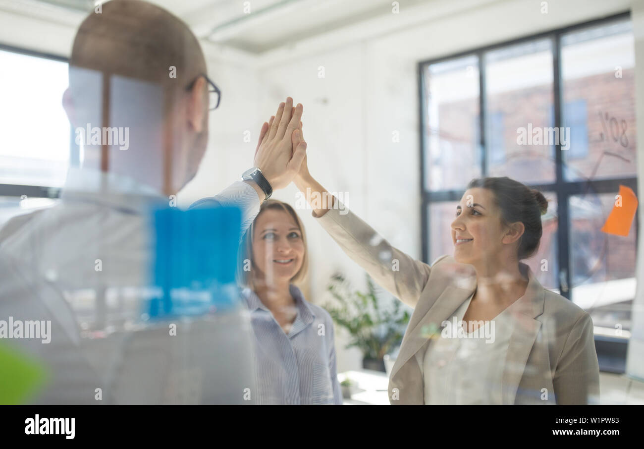 Teamwork high five hands hi-res stock photography and images - Alamy