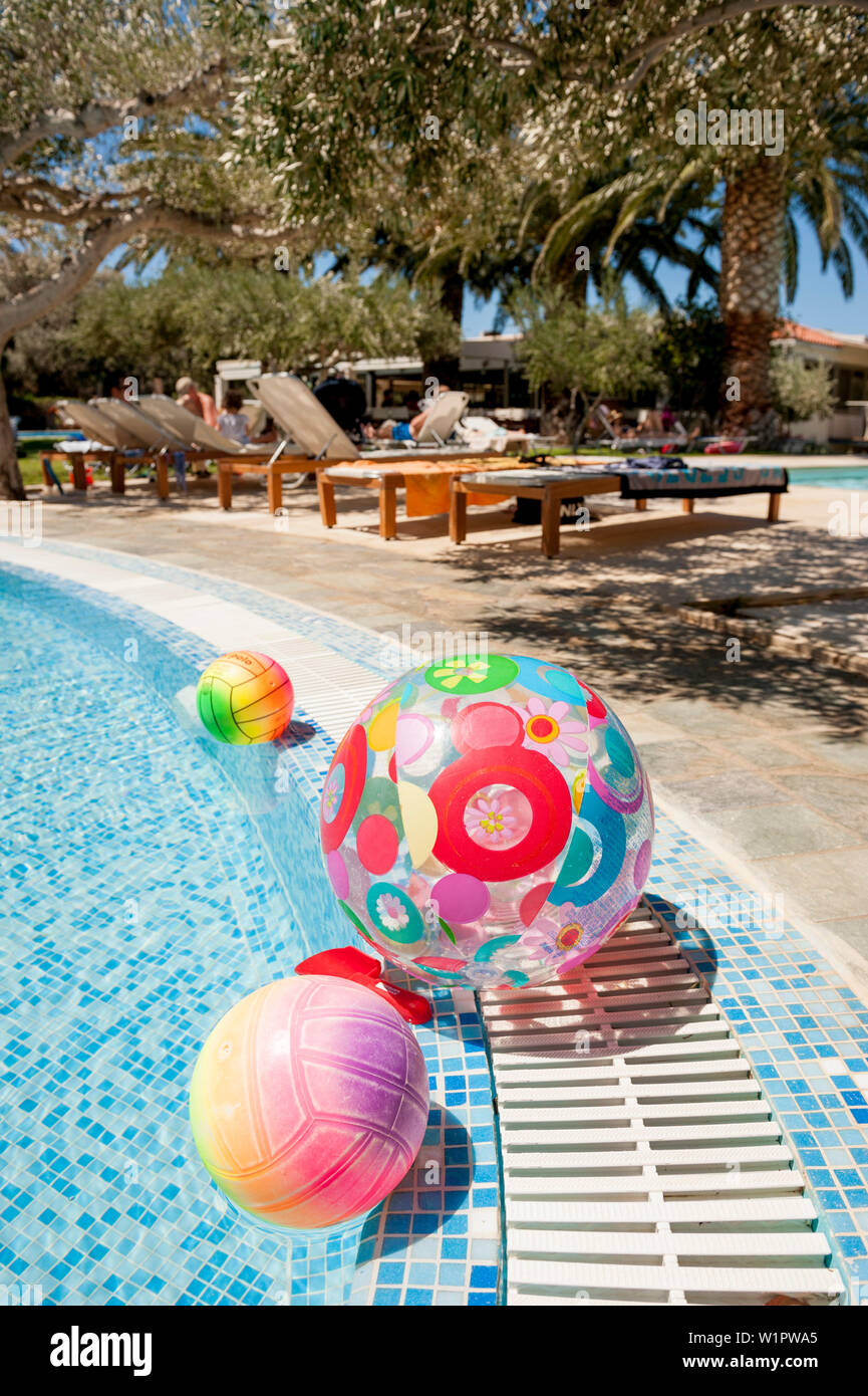 beach ball in the hotel pool, garden, Agia Galini, Crete, Greece ...