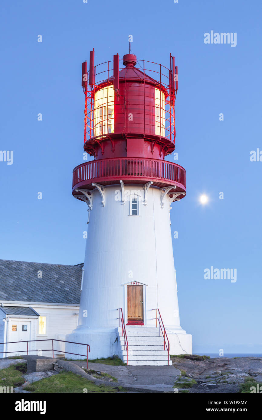 Moon above lighthouse Lindesnes fyr at the Cape Lidesnes, Skagerak ...