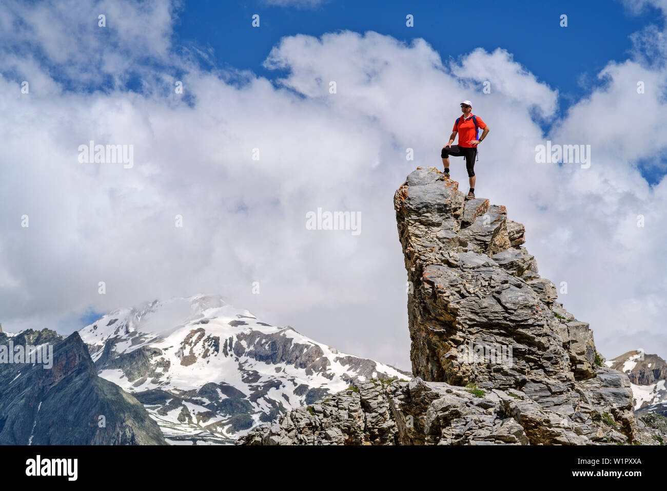 Man standing on rock spire, Passo della Cavalla, Val Maira, Cottian ...