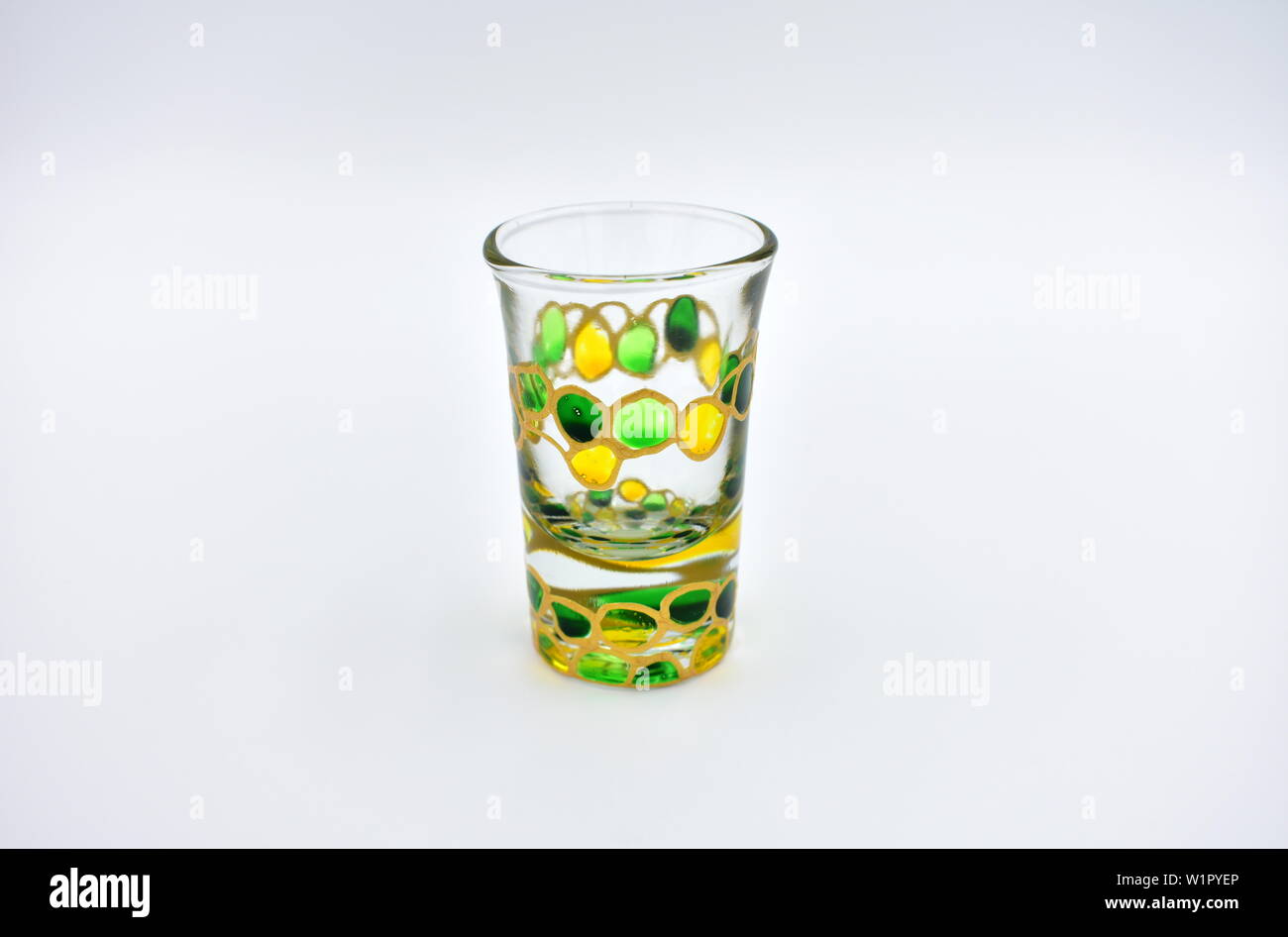Small glass with colours isolated on a white background Stock Photo - Alamy