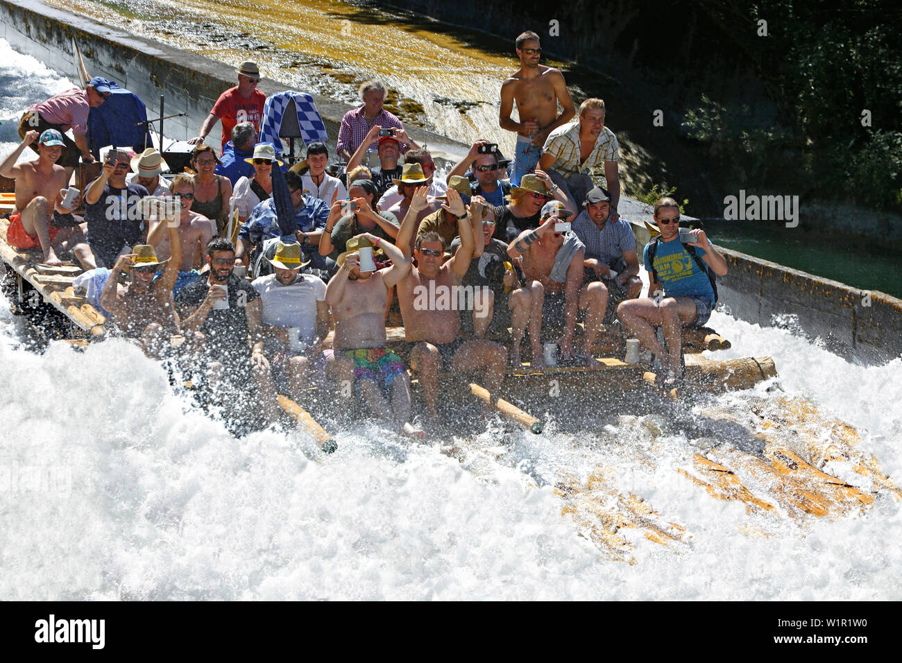 People on a traditional wooden raft on a shute in Thalkirchen, Munich ...