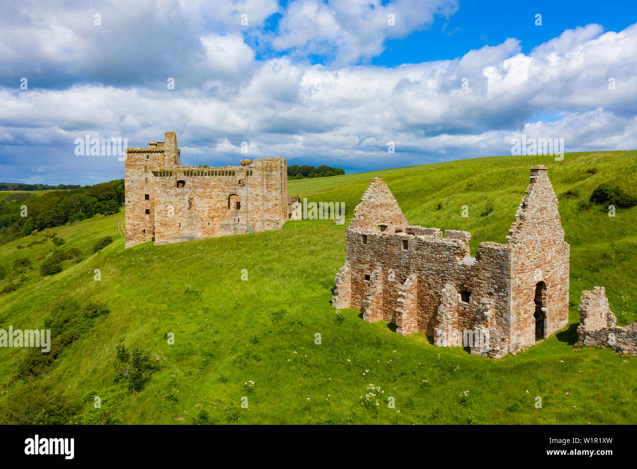 Elevated view of 14th century Crichton Castle and stables in Midlothian ...