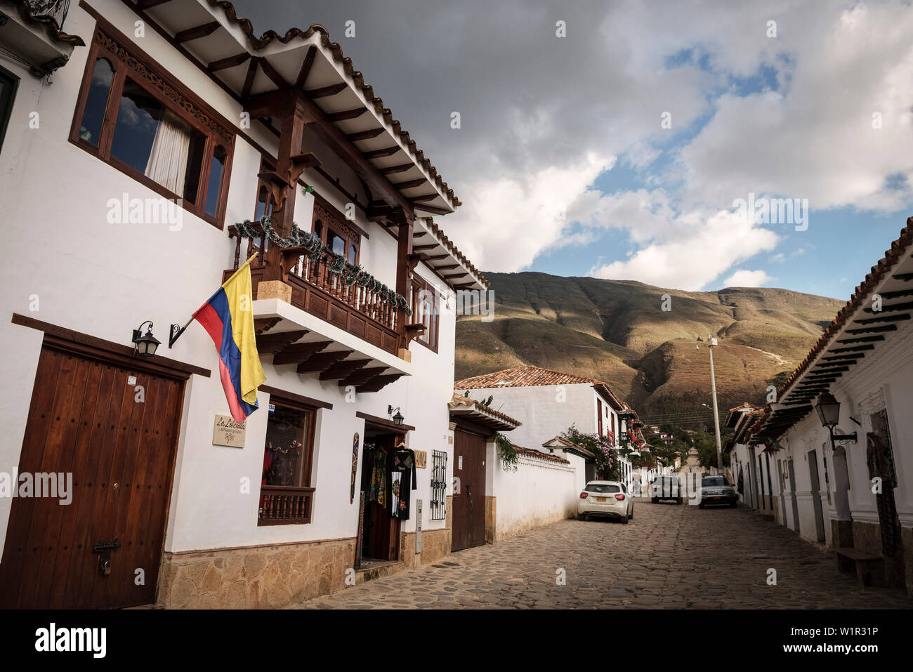 typical colonial style balconies with view at surrounding Andean Peaks ...
