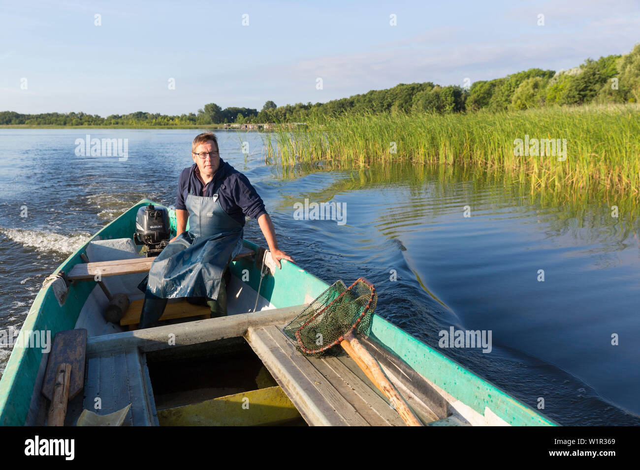 Fisherman Dieter Bork fishing, lake fishery, lake Woblitzsee ...