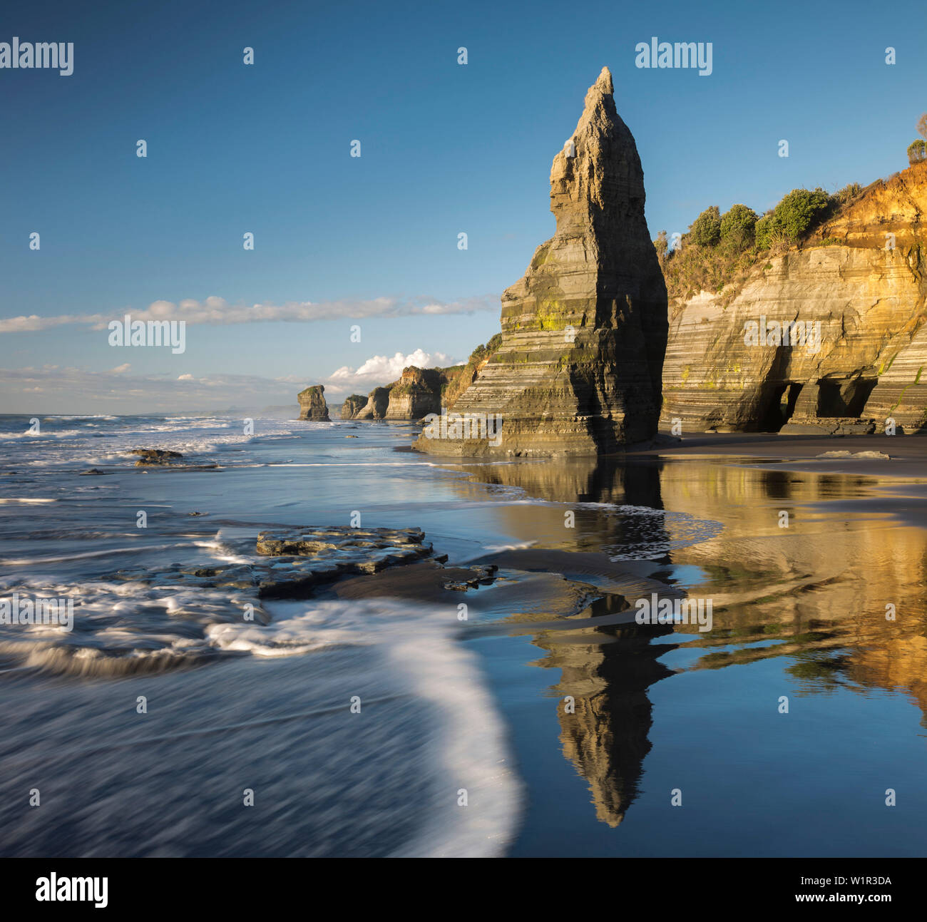 Rock formation and refection in the water, Tongaporutu, Taranaki, North ...