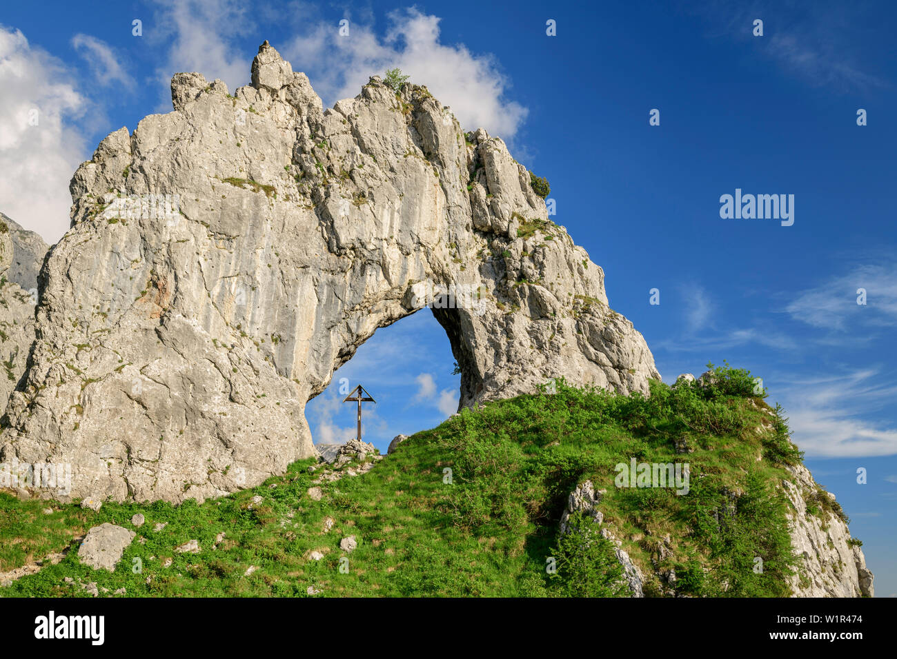 Rock arch with crucifix, Grigna, Bergamasque Alps, Lombardy, Italy ...
