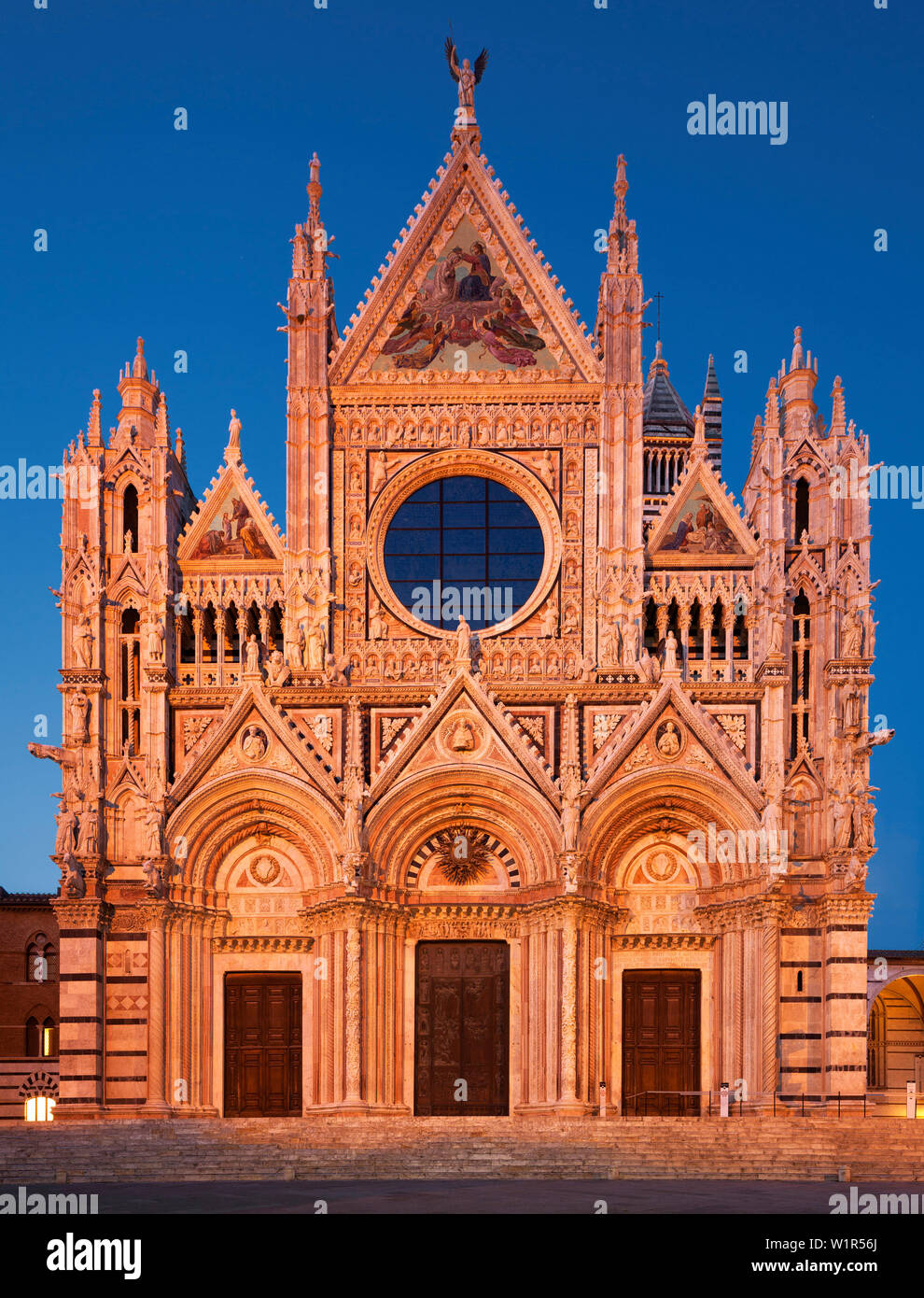 Facade of the cathedral Cattedrale di Santa Maria Assunta in Siena with ...