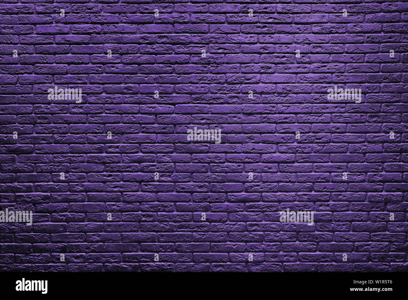 Violet brick wall background Stock Photo - Alamy