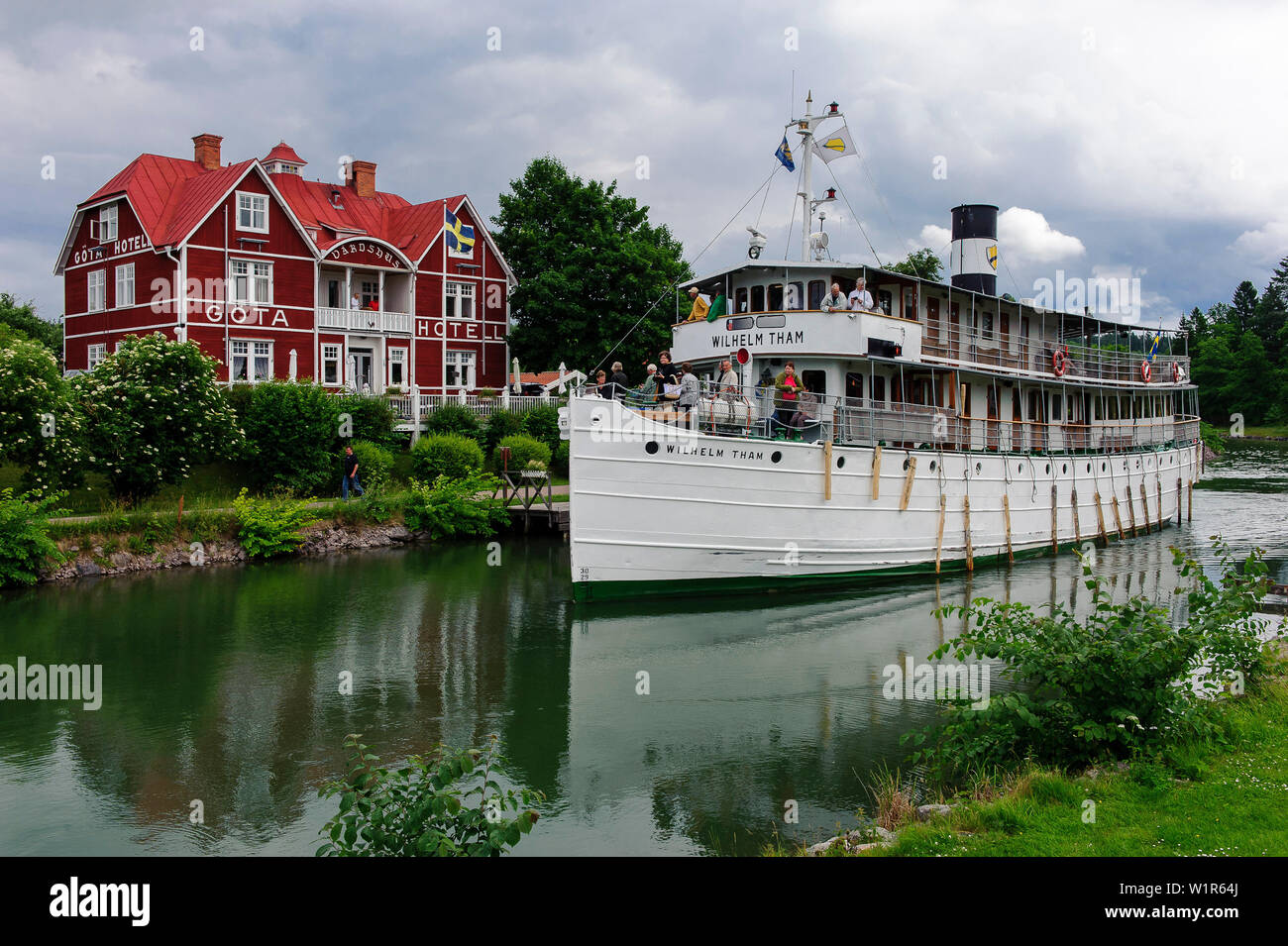Tandem driver in front of steamer Wilhelm Tham on the Goetak canal ...