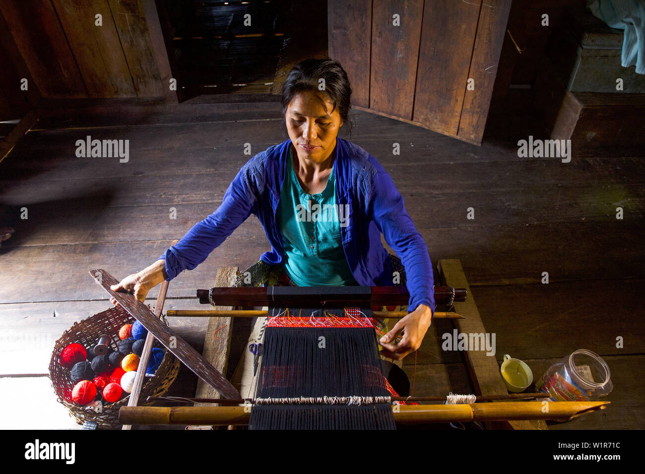 Woman makes traditional clothes in Arunachal, India, Asia Stock Photo ...