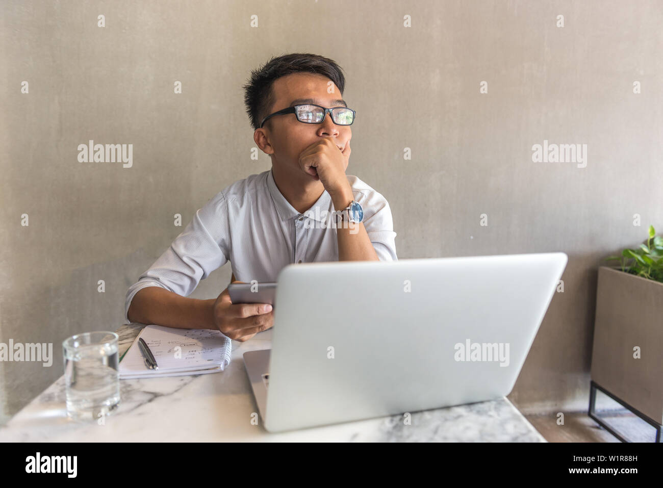 Putting hand on her chin hi-res stock photography and images - Alamy