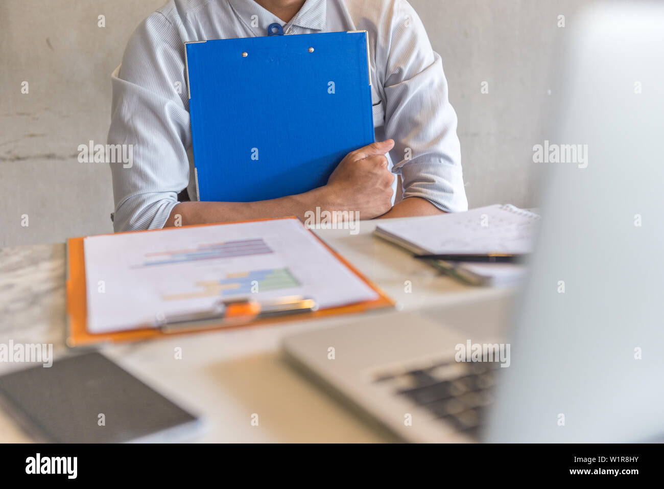 Close up photo of office man hands holding folder Stock Photo - Alamy