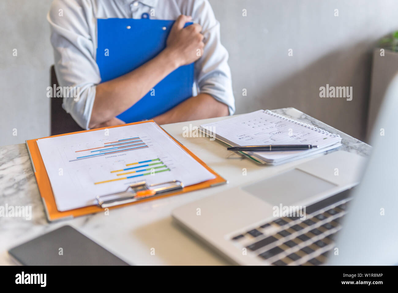 Close up photo of human hands holding document at office Stock Photo ...