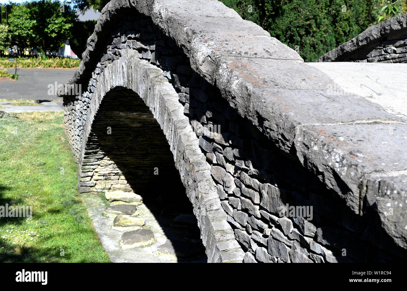 Stone viaduct bridge in a local park across small river in Santa Rosa ...