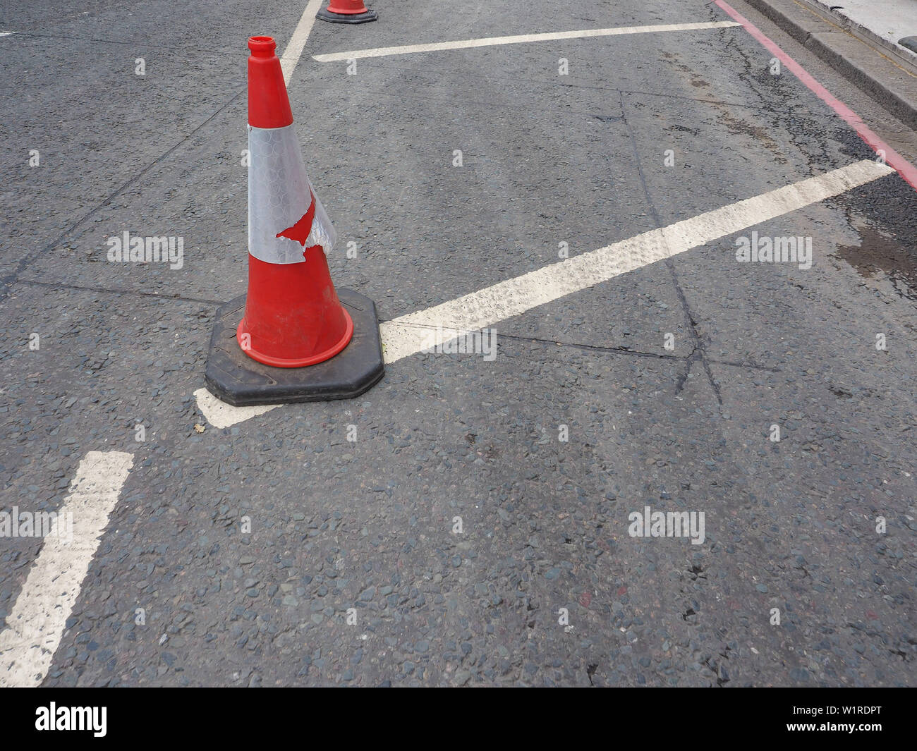 traffic cone to mark road works or temporary obstruction traffic sign ...