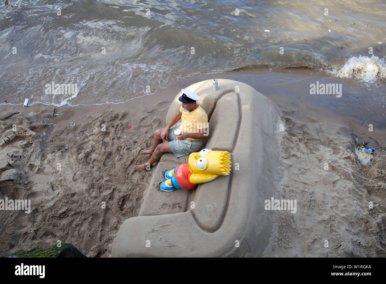 Bart Simpson model relaxing on sand sofa, southbank London Stock Photo ...