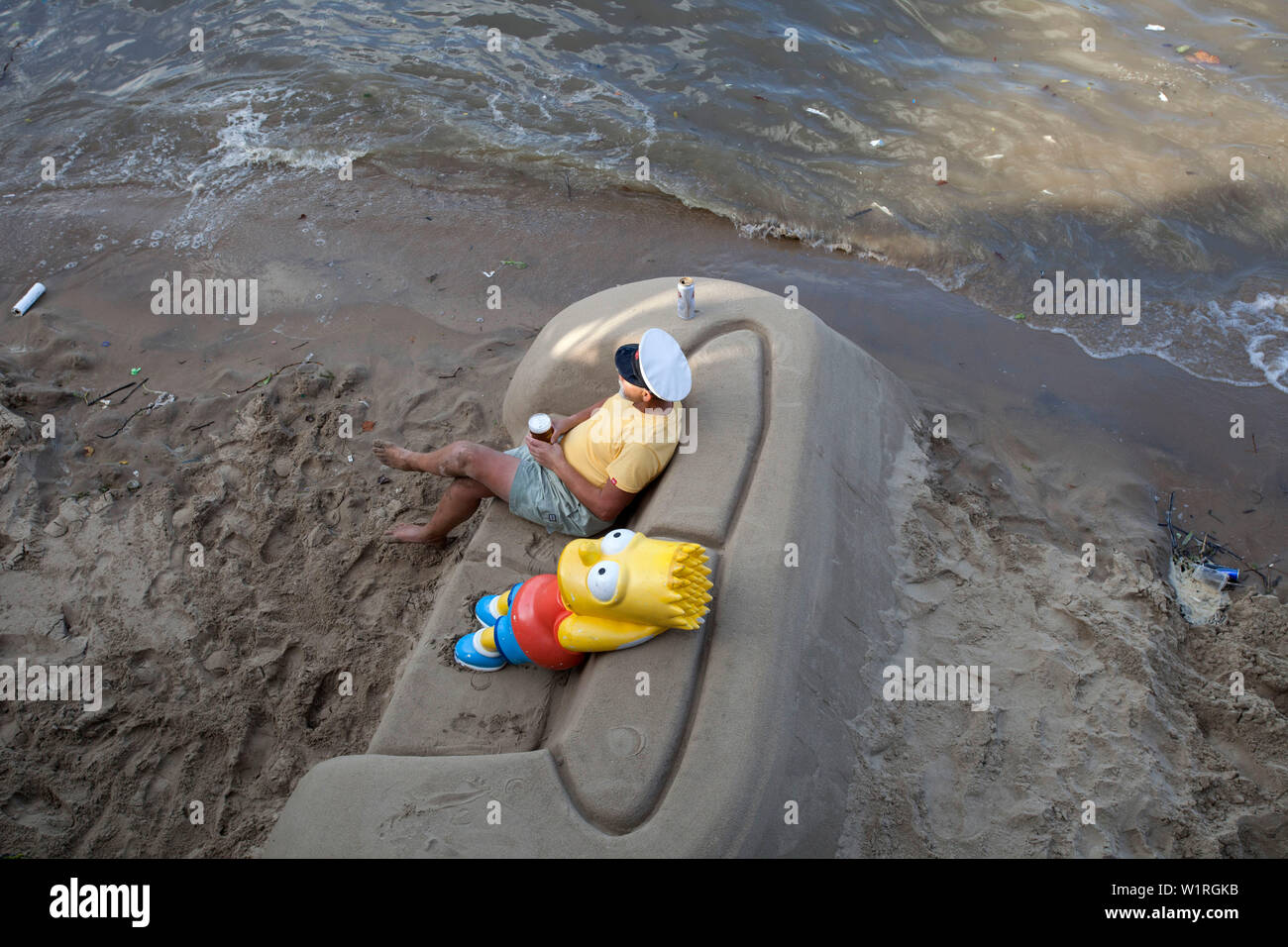 Bart Simpson model relaxing on sand sofa, southbank London Stock Photo ...