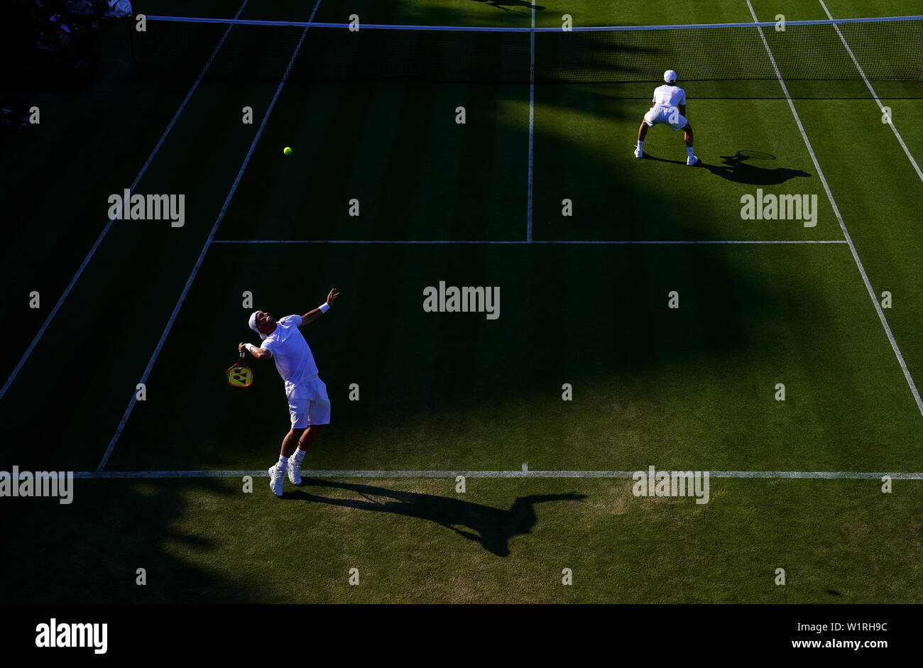Lleyton Hewitt serving on day three of the Wimbledon Championships at ...