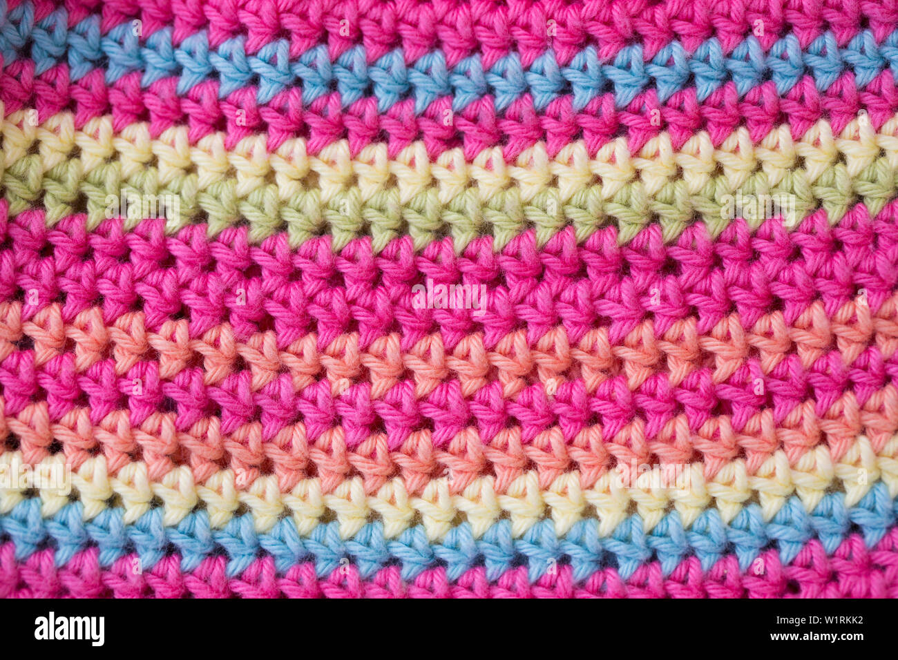 Crocheted colorful woolen background pattern Stock Photo - Alamy