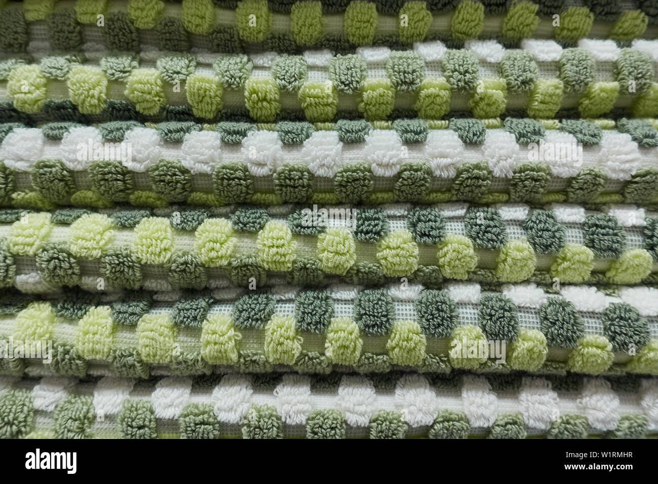 Stack of folded towels close-up on the shelf Stock Photo - Alamy