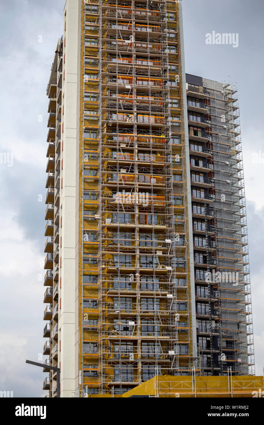 Modern high-rise residential building under construction. Residential ...
