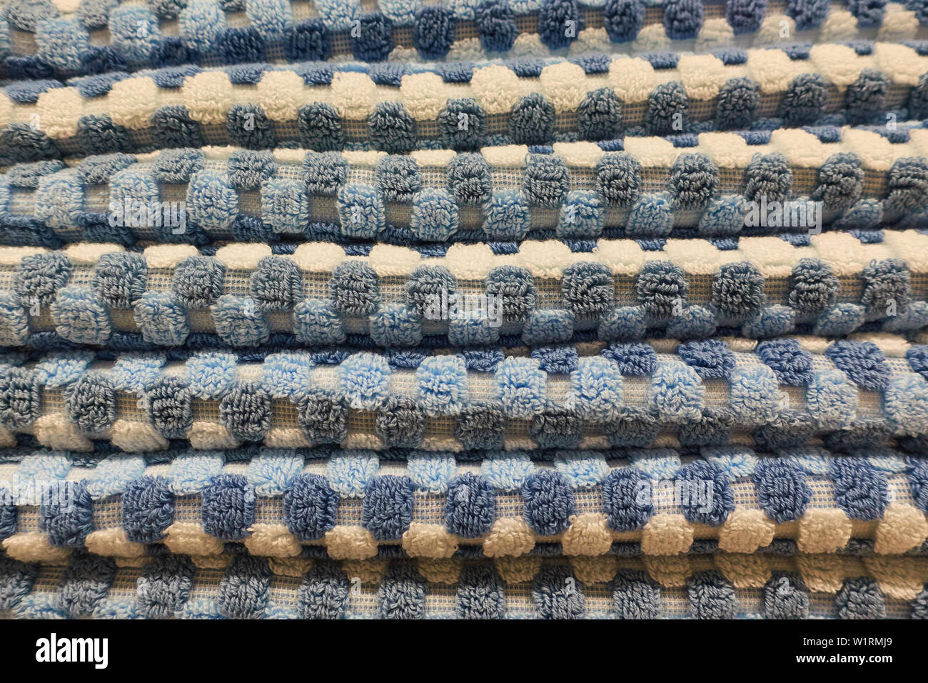 Stack of folded towels close-up on the shelf Stock Photo - Alamy