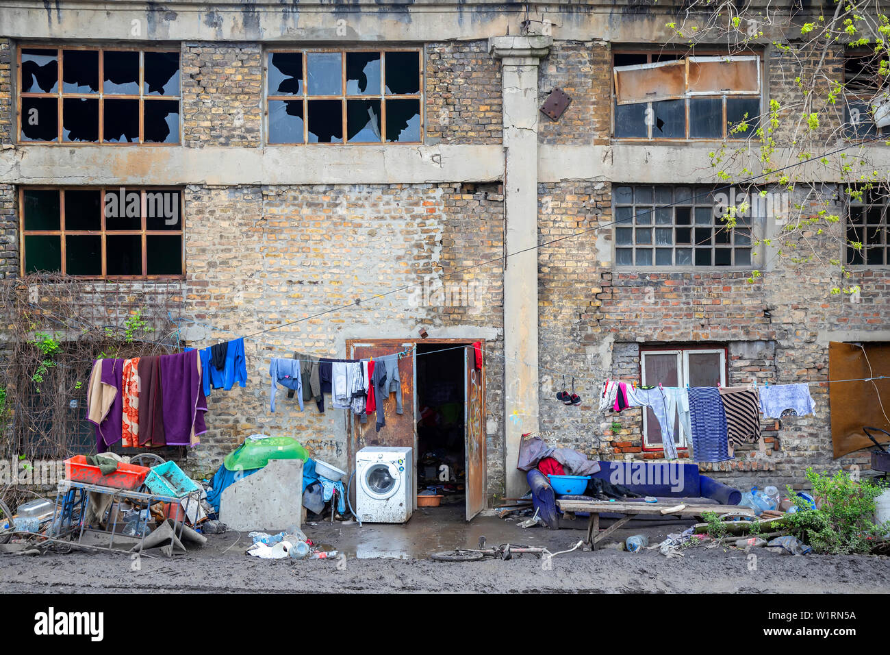 Poor living and homeless ghetto in abandoned warehouse Stock Photo - Alamy
