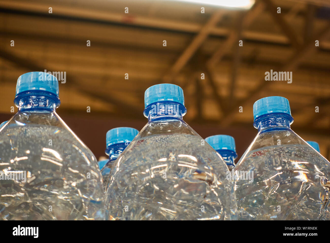 Plastic bottles with mineral water on the shop counter Stock Photo - Alamy
