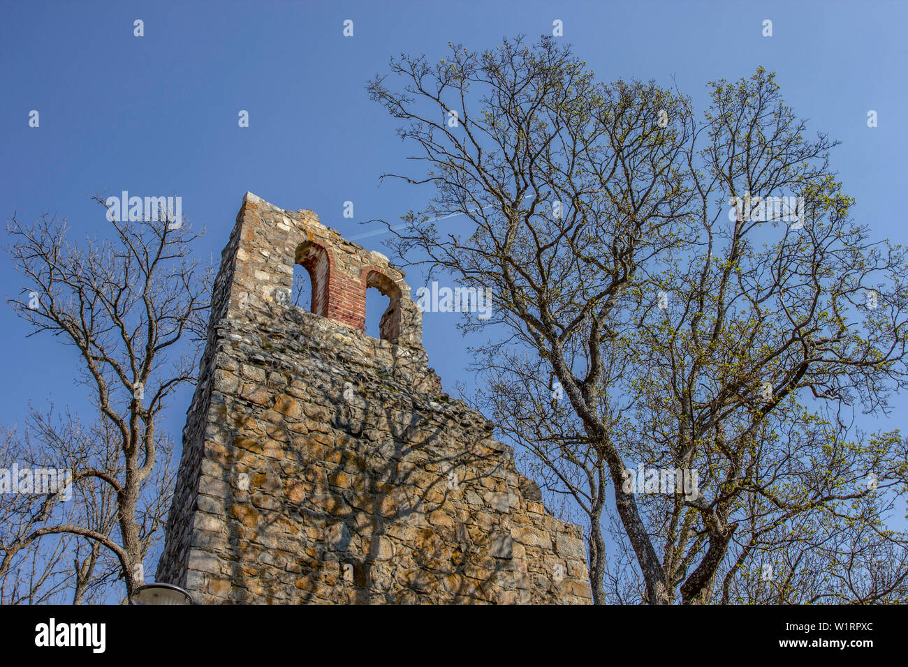 The tall ancient stone ruin of St Lawrence church still stands over the ...